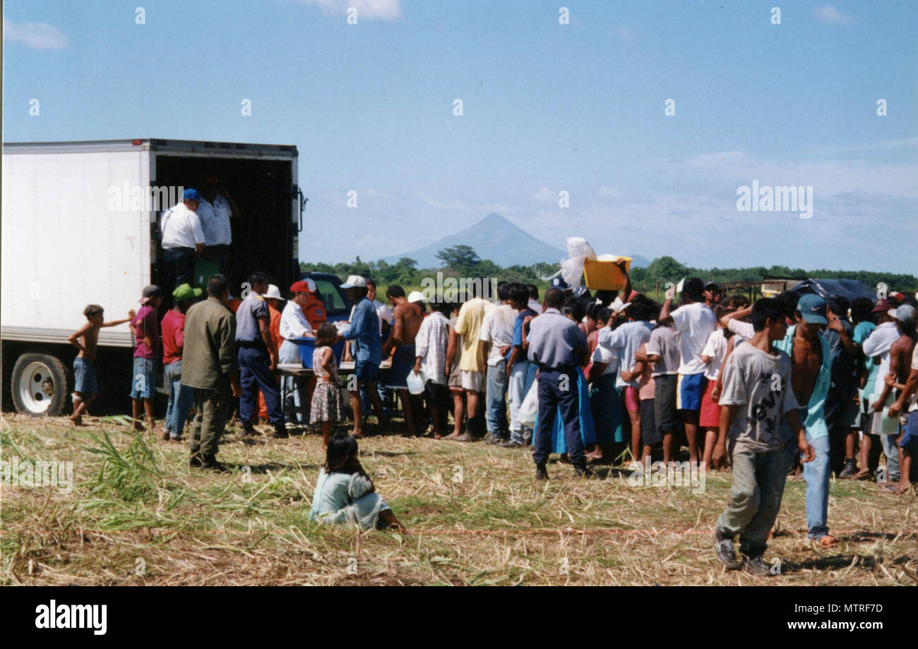 men and women in line getting food Stock Photo - Alamy