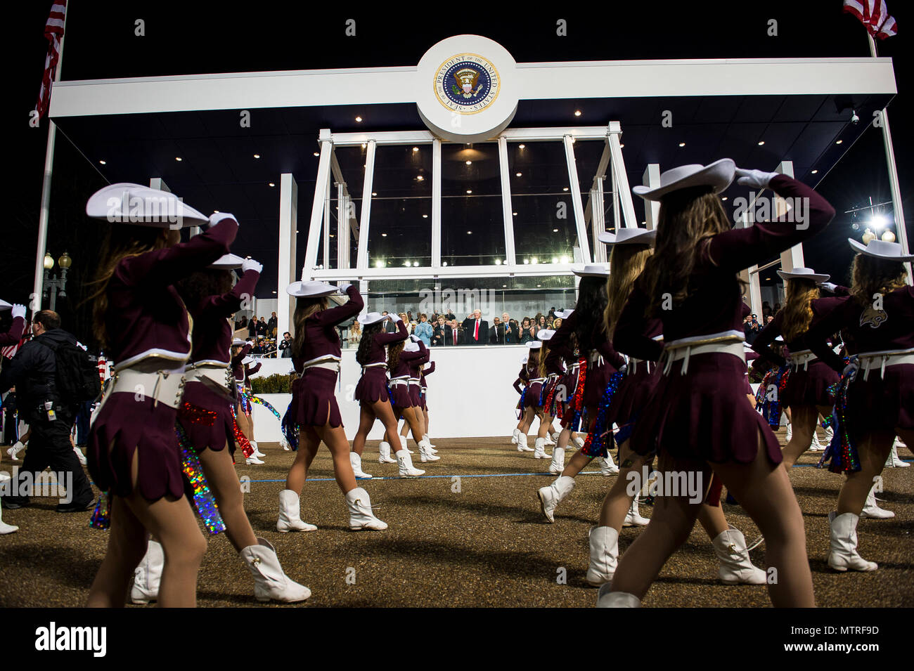 The Strutters dance team from Texas State University salutes the ...