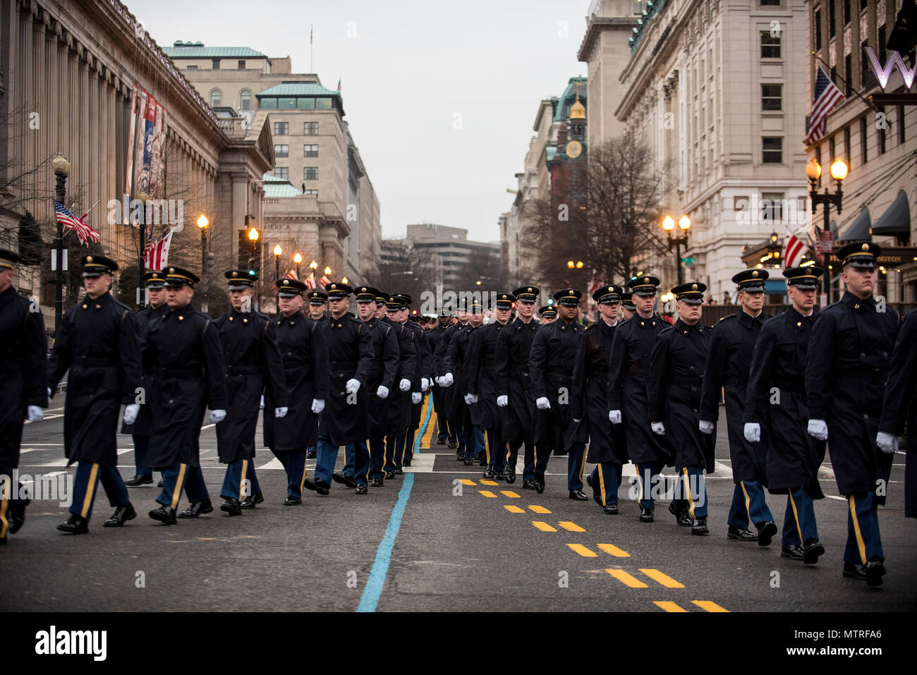 A formation of U.S. Army Soldiers splits out to the sides to allow ...