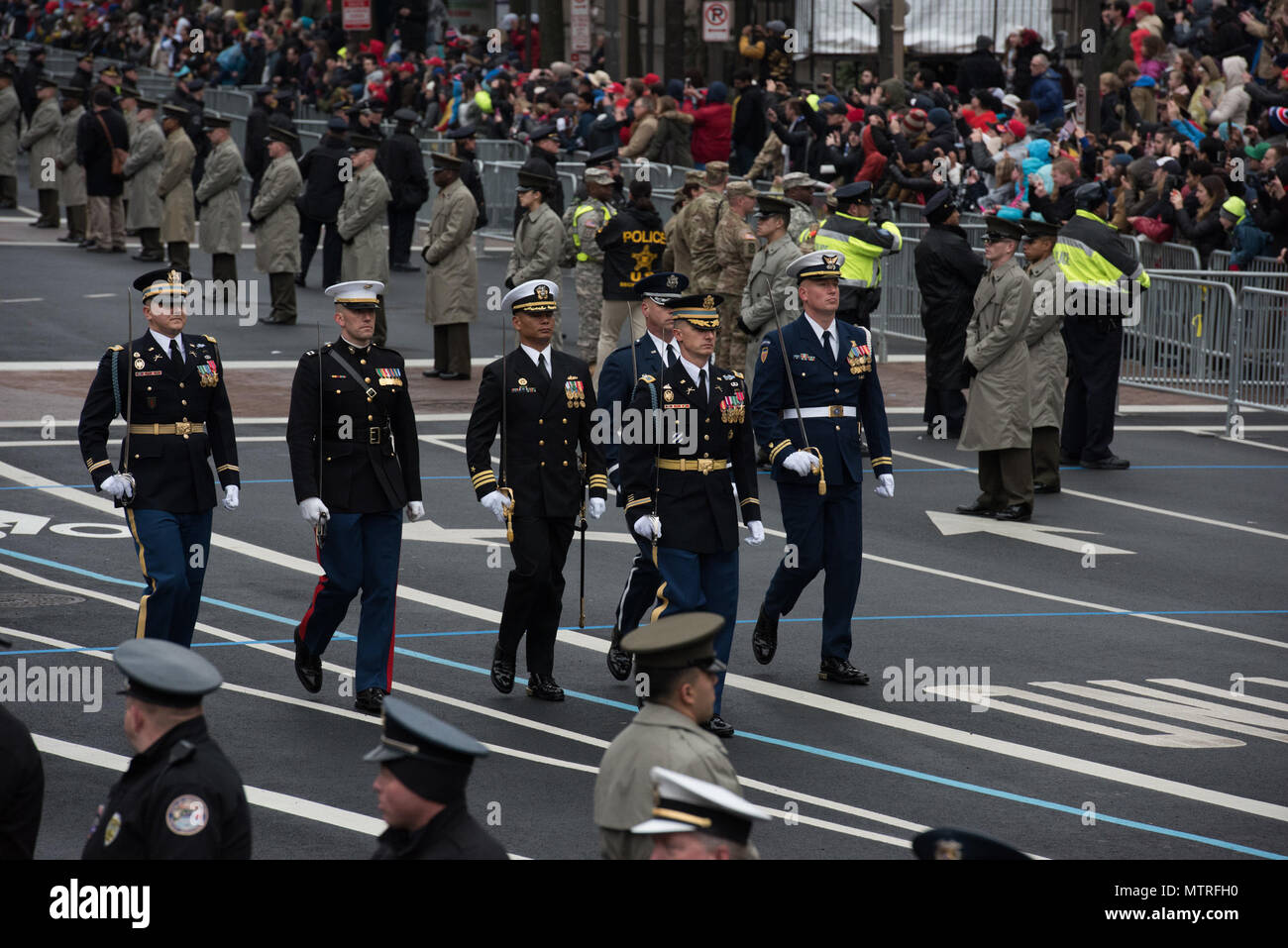 U.S. Servicemembers march down Pennsylvania Avenue during the ...