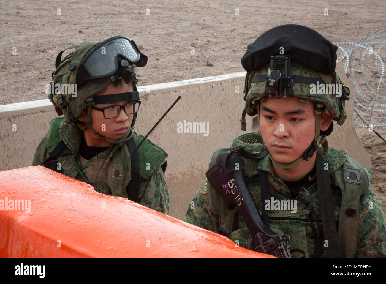 U.S. Army and members of the Singapore Army participate in a simulated ...