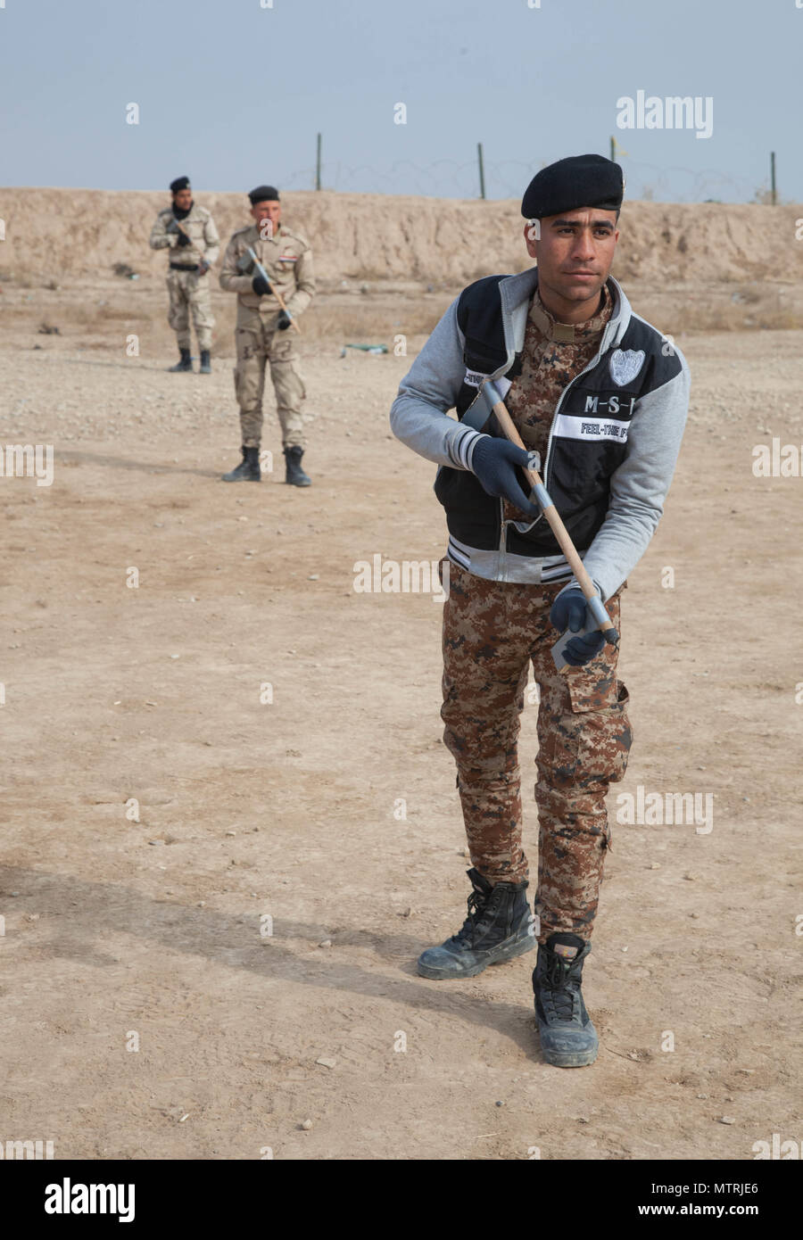 Iraqi security forces practice traveling in tactical formations at ...