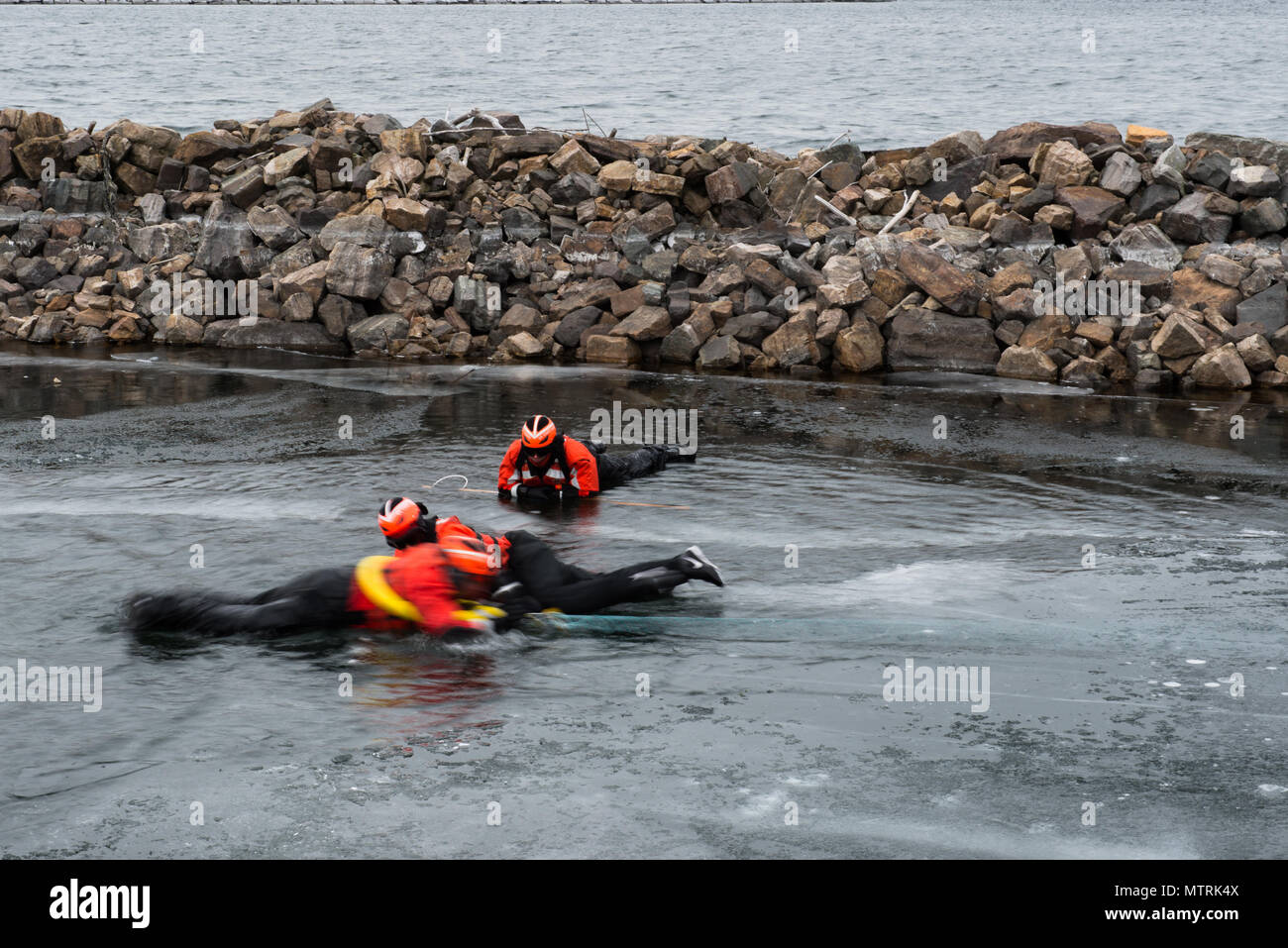 A Coast Guard Station Burlington ice rescue team trains using a cold ...