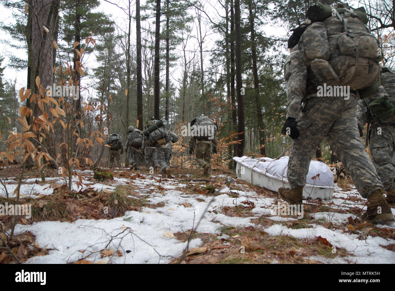 Soldiers in the Mountain Warfare Course on Fort Drum work together to ...