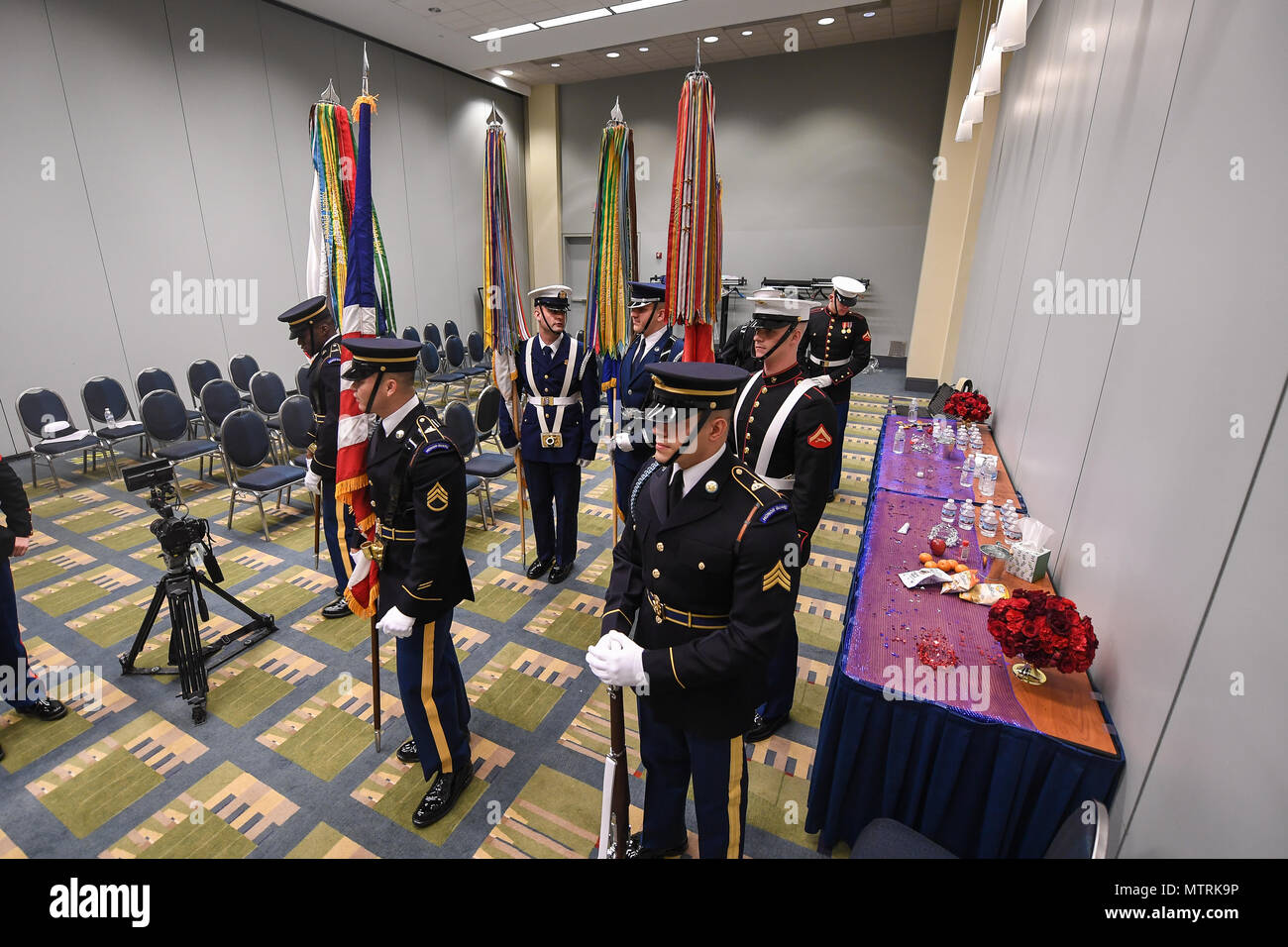Members of the U.S. Military Joint Services Color Guard await ...