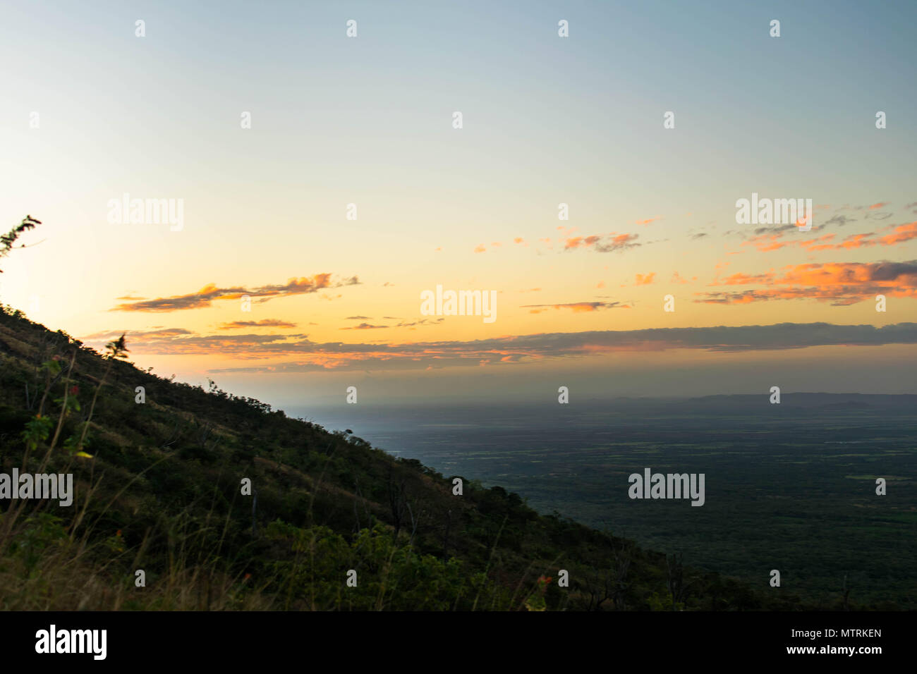 View of a rising sun from half way up San Christobal, Nicaragua's ...