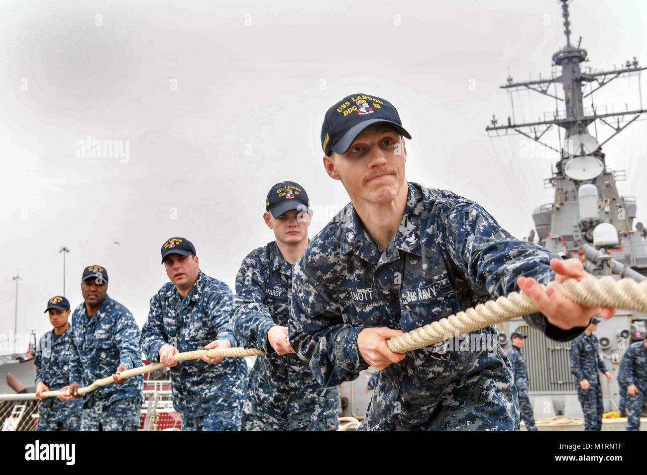 170121-N-ZY039-081 NORFOLK, Va. (Jan. 21, 2017) Sailors heave aboard ...