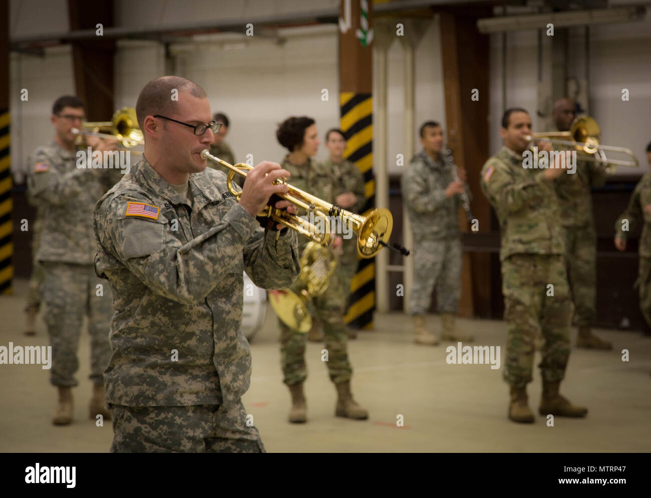 Featured trumpet player Sgt. Peter Schiller, pictured, rehearses his ...