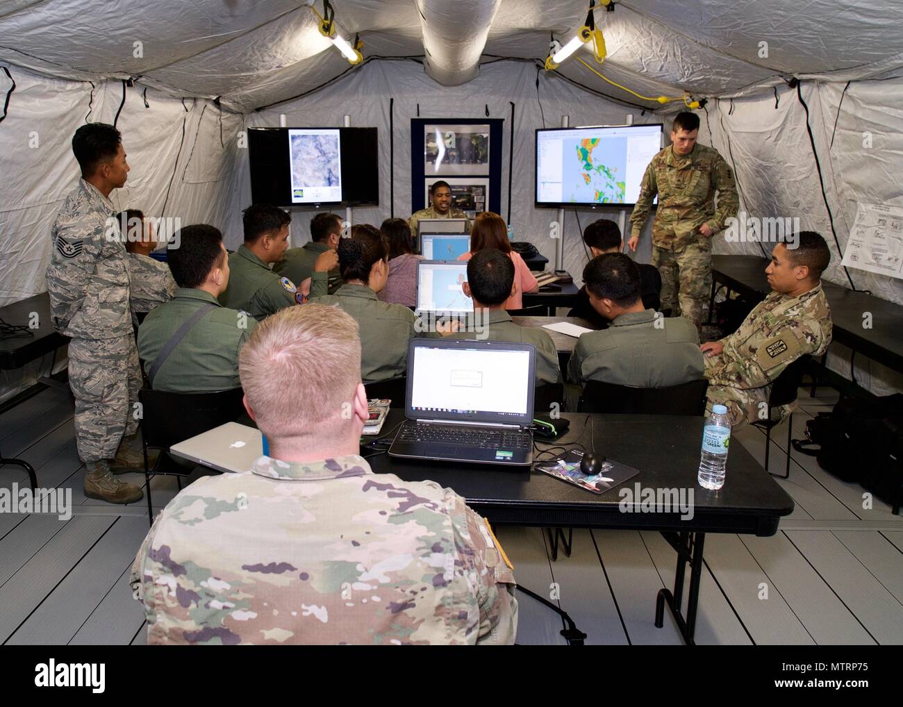 A combined group of Philippine and U.S. service members follow Spc ...