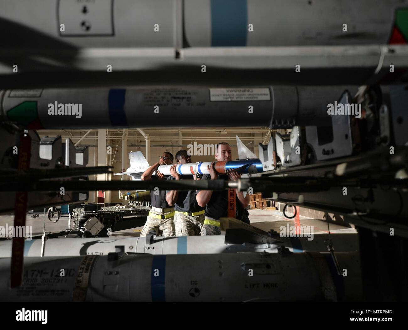 U.S. Air Force Staff Sgt. Christopher A. Holmes, Senior Airman Michael ...