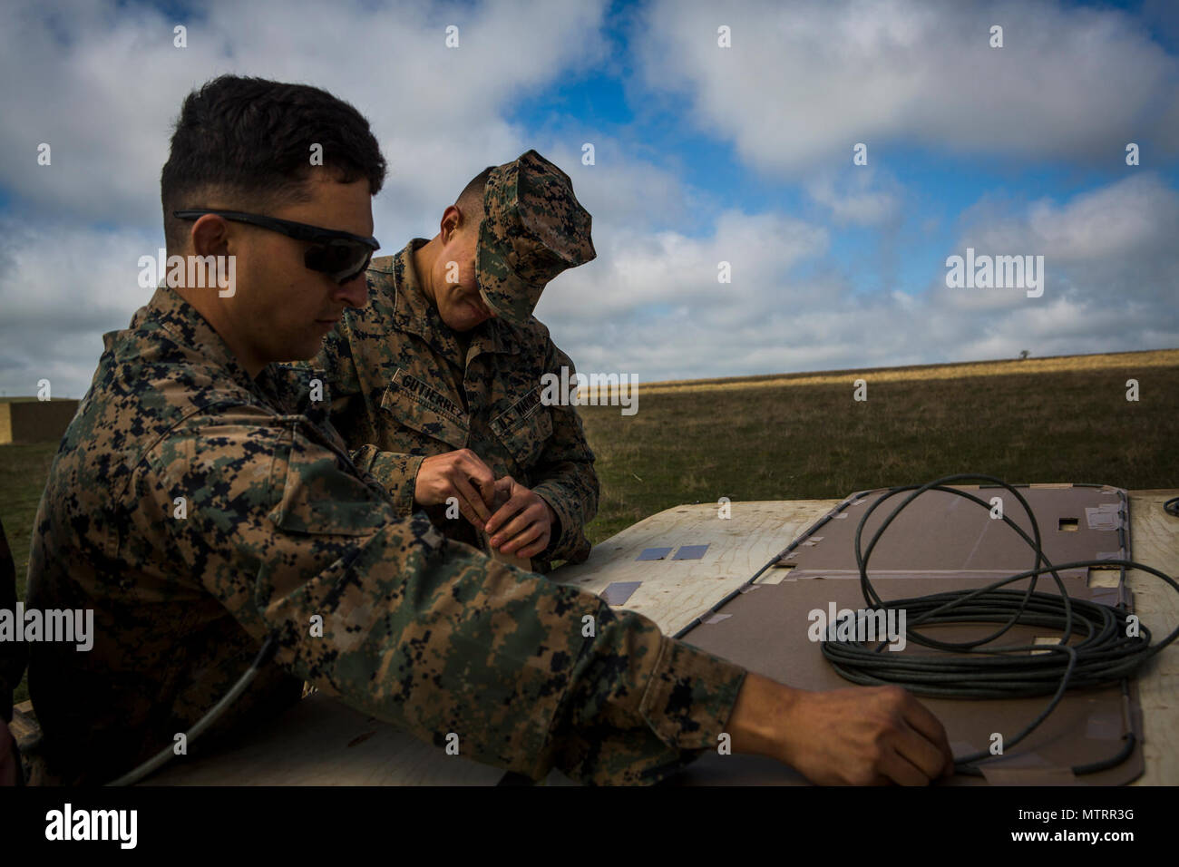 U.S. Marines with Black Sea Rotational Force 17.1 place detonation cord ...