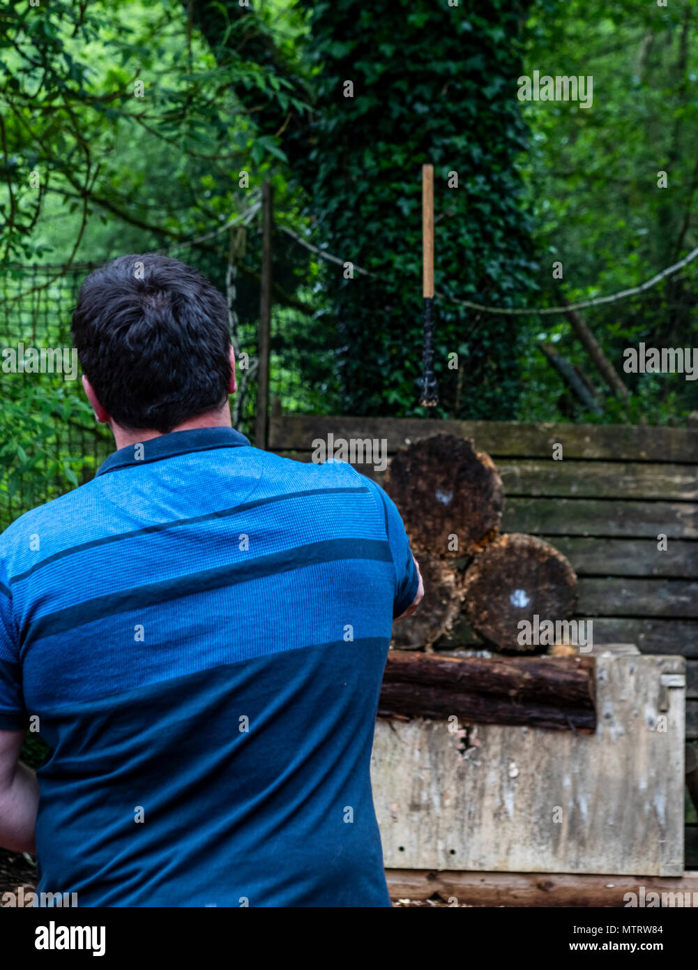 A man throwing a woodcutter's axe at a target. Fire and Wood at Dean ...