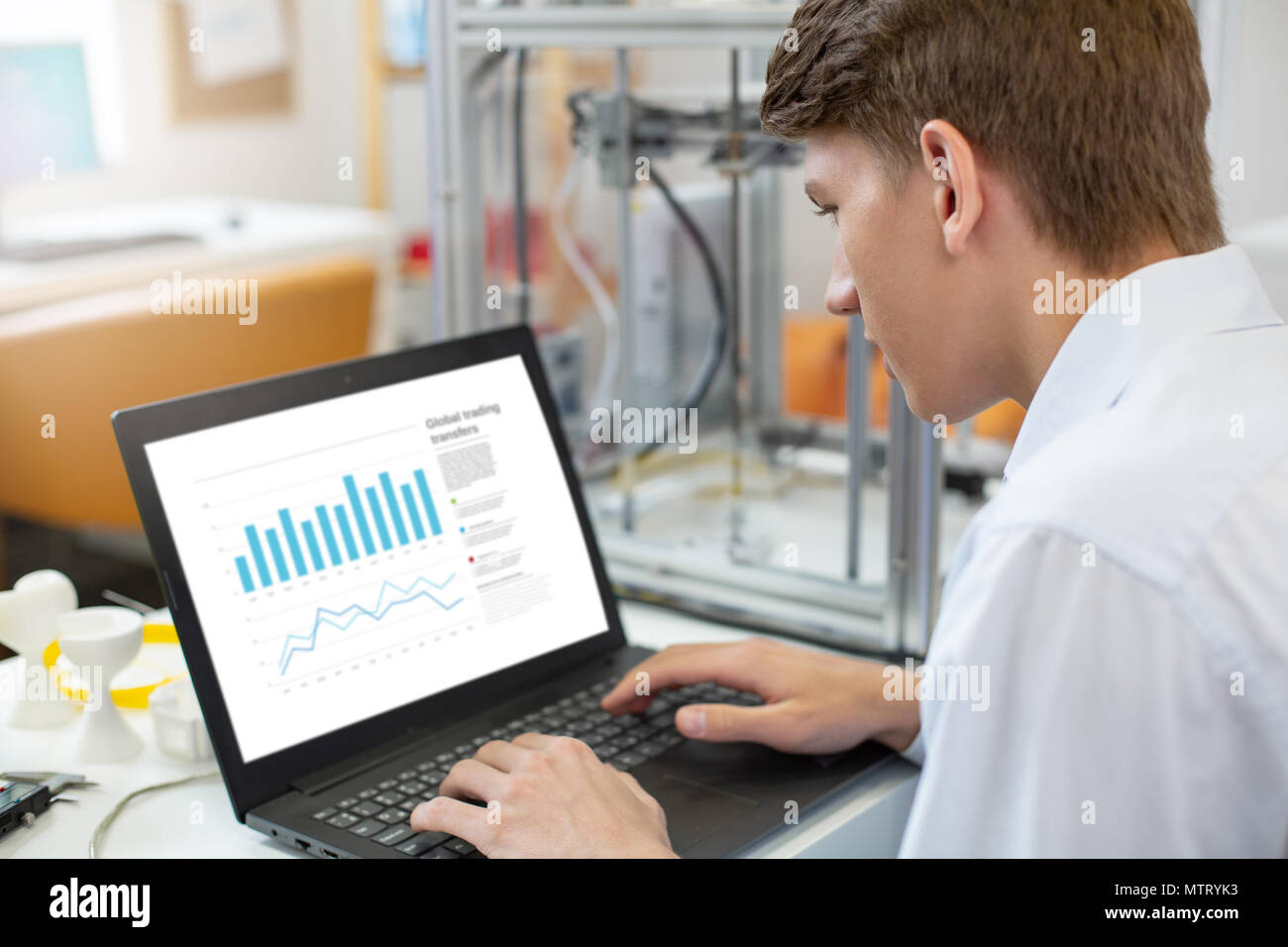 Handsome young man working on presentation Stock Photo - Alamy