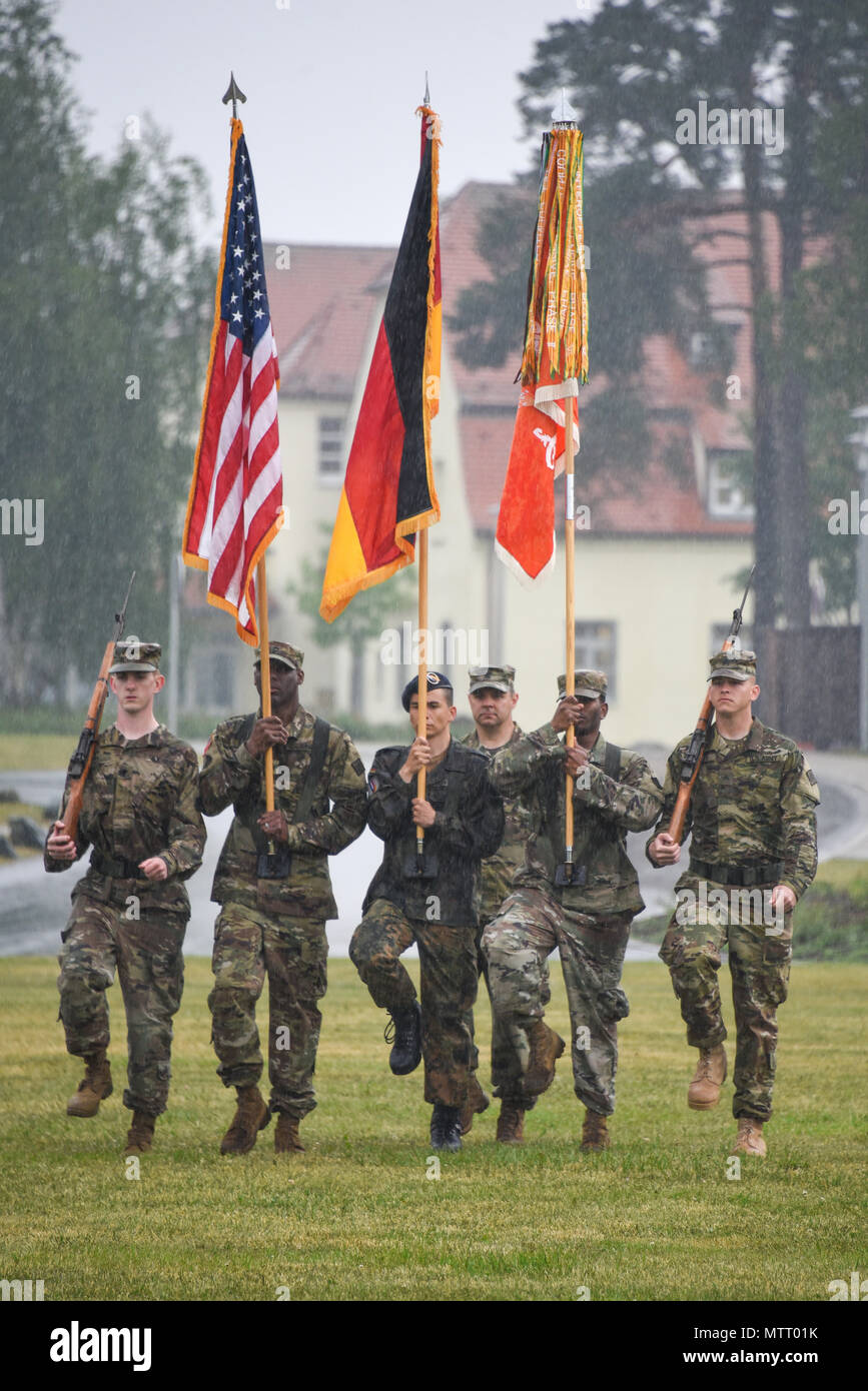 The ceremonial color guard advances to the front of the formation ...