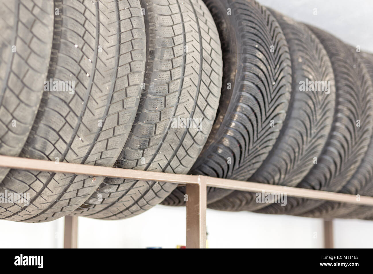Tire seasonal storage. Set of car wheels on special shelf at home ...