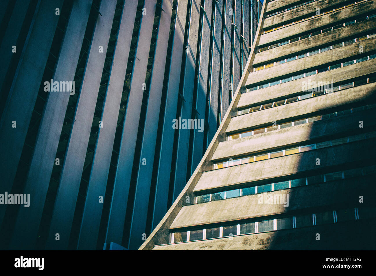 Golden ambience surrounds concrete business modern building Stock Photo ...