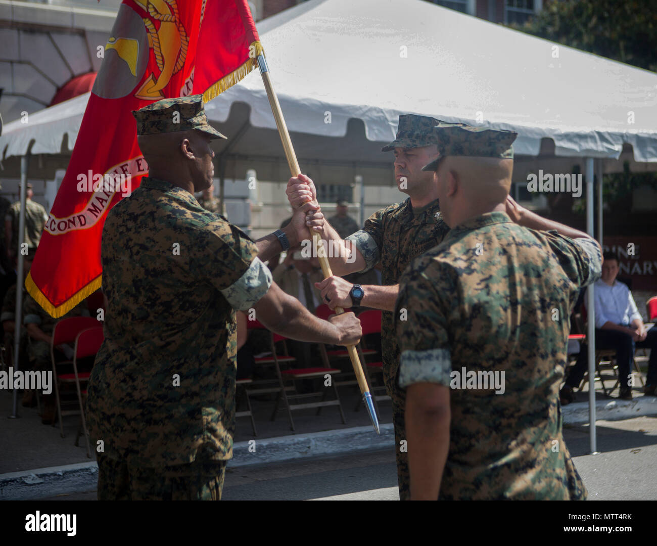 U.S. Marine Corps Brig. Gen. Michael E. Langley, passes the colors to ...