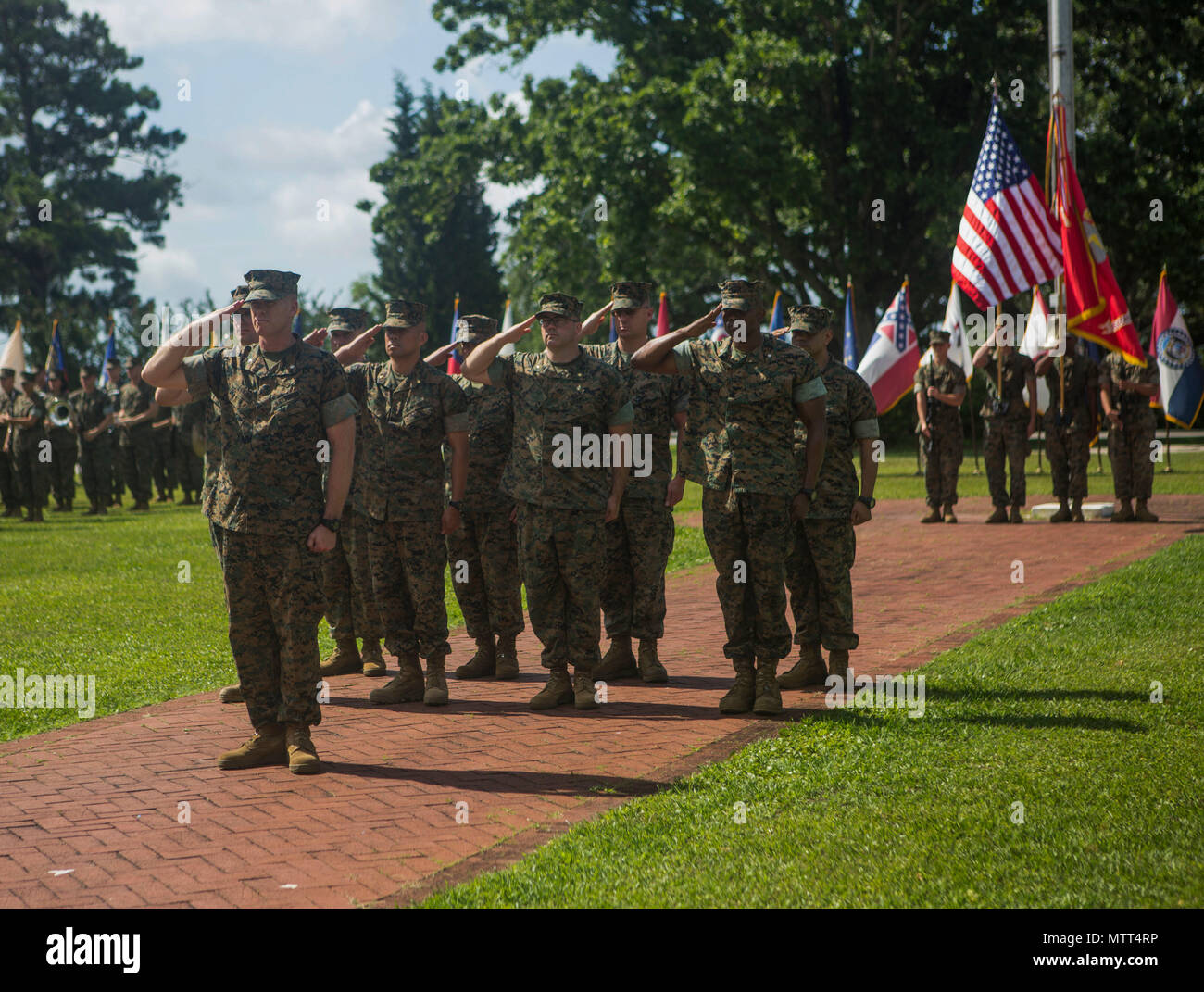 U.S. Marines with 2nd Marine Expeditionary Brigade (MEB) salute the ...