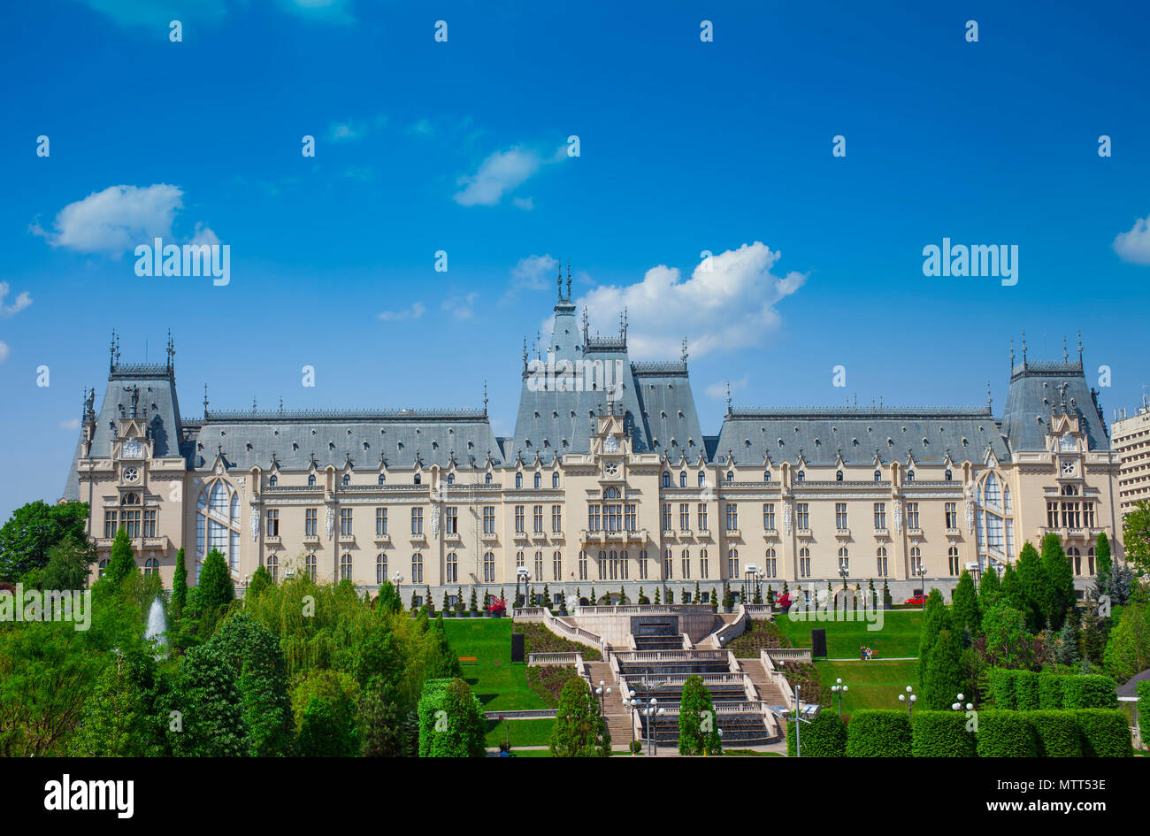 the Palace of Culture in Iasi city, Romania. green park and blue sky ...