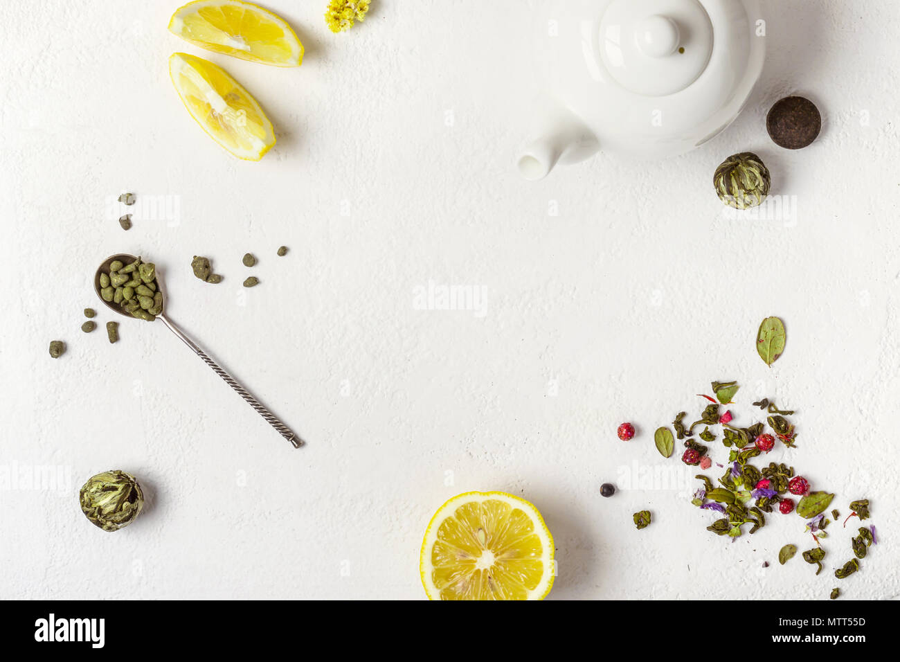 Tea concept. Selection of different varieties of tea and white teapot ...