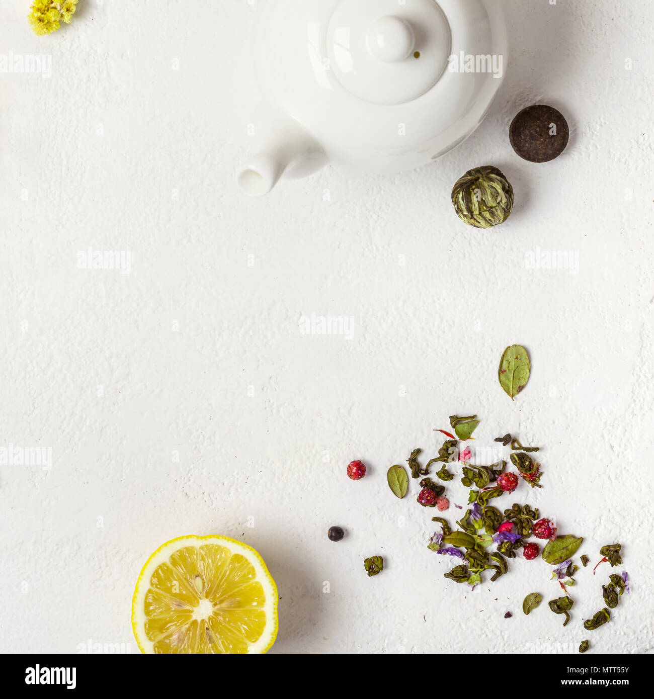 Tea concept. Selection of different varieties of tea and white teapot ...