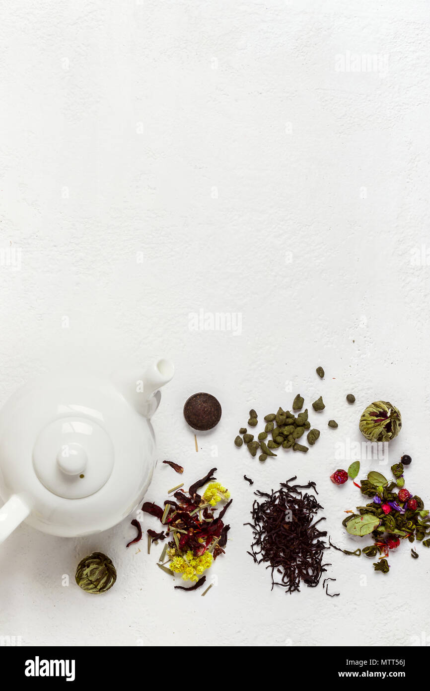 Tea concept. Selection of different varieties of tea and white teapot ...