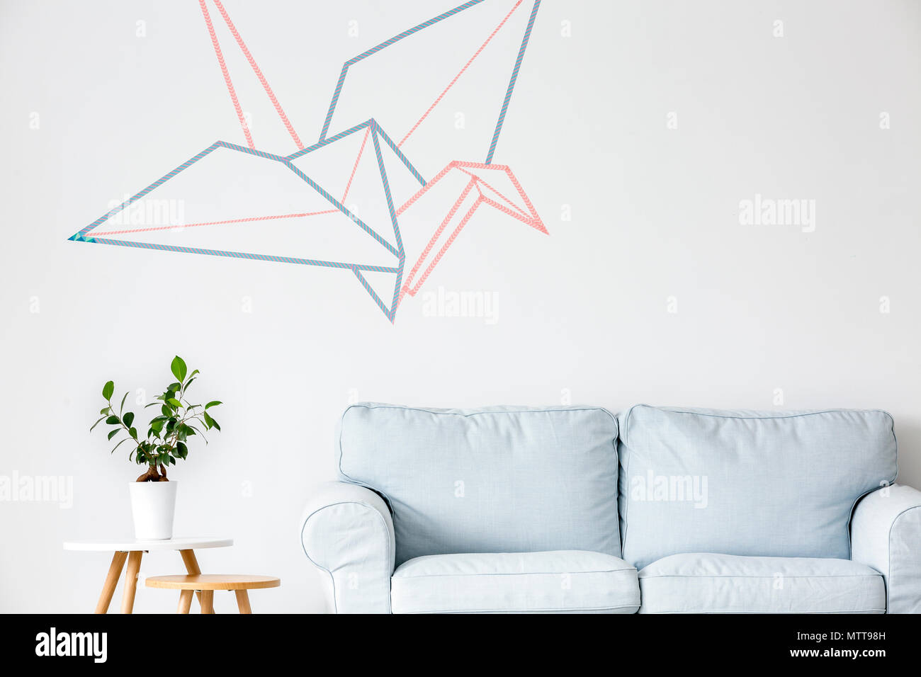 Origami crane vector graphic on the wall in living room Stock Photo - Alamy