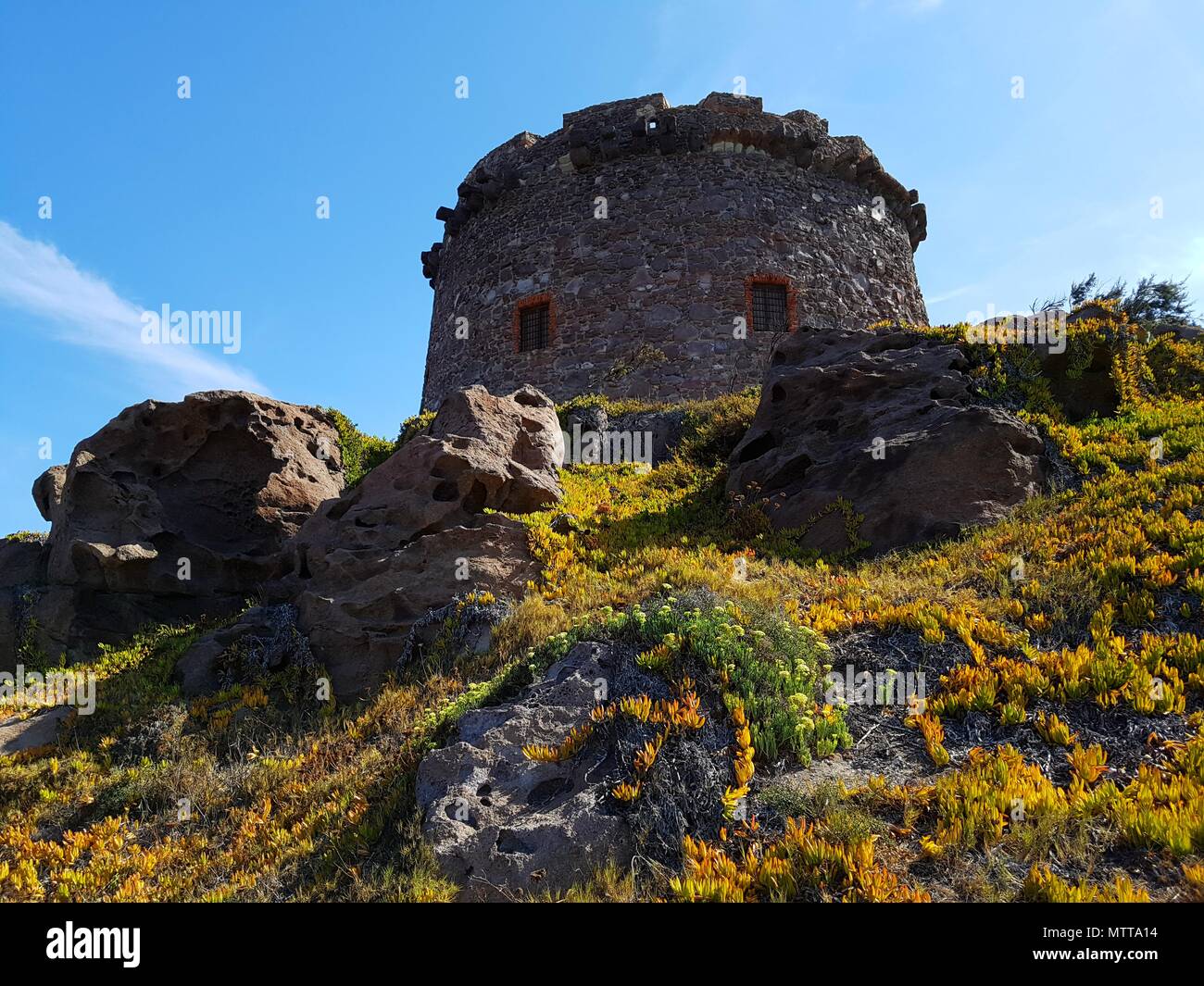 spanish watchtower in portoscuso sardinia in italy Stock Photo - Alamy
