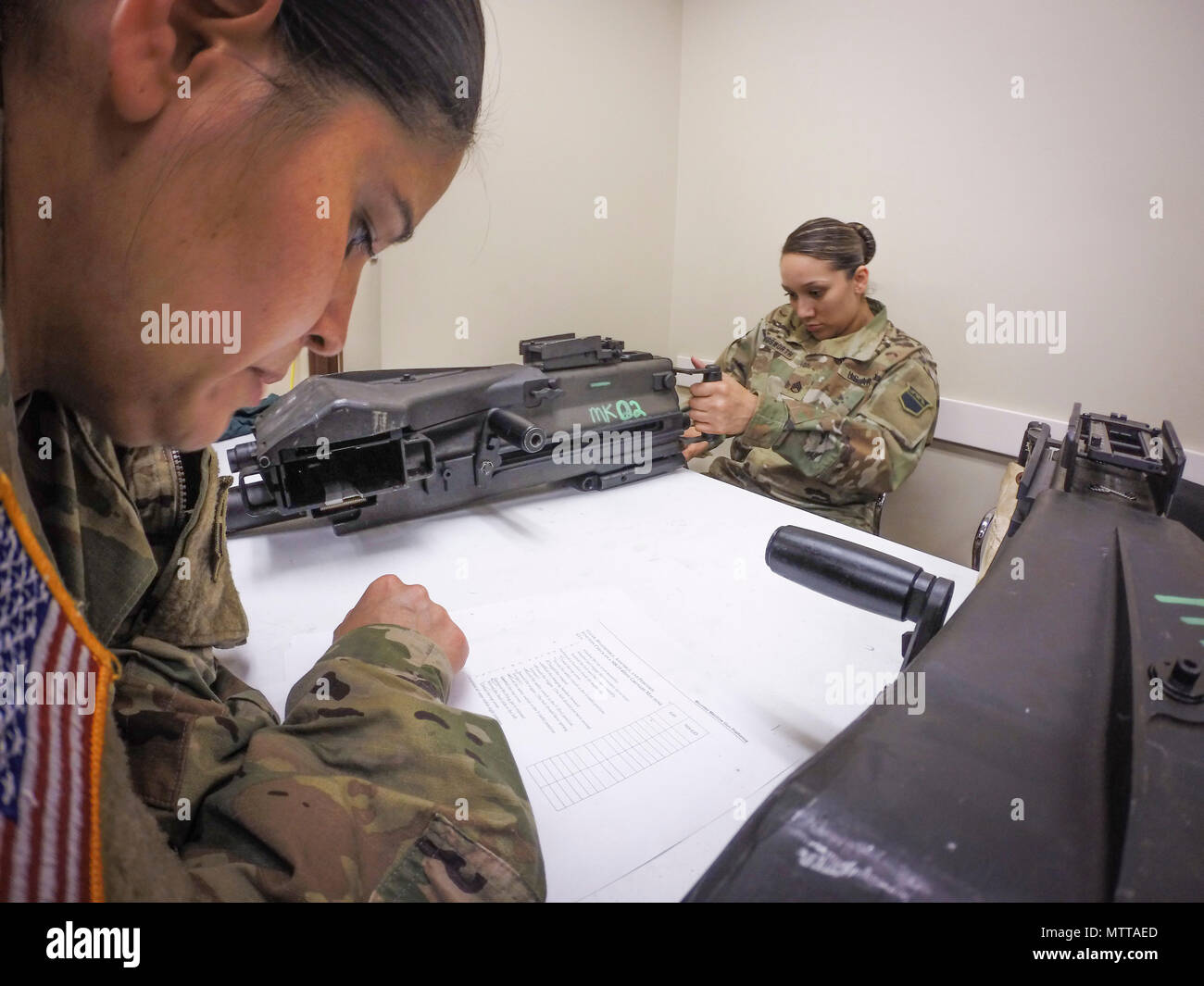 Army Reserve Staff Sgt. Ann Carrier (left), a nuclear, biological, and ...
