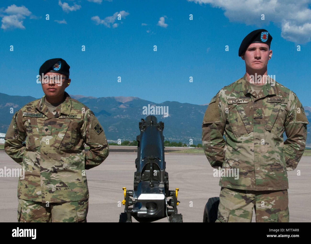 U.S. Army Spc. Hernandez and Pfc. Leahy standby before firing a 19-gun ...