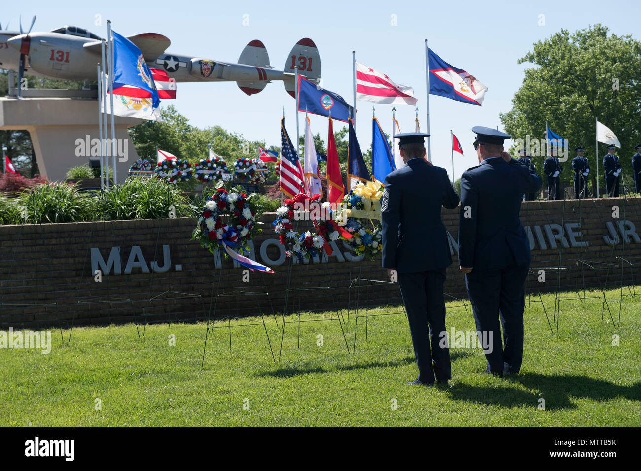 Two U.S. Air Force Airmen salute a wreath during the Parade of Wreaths ...