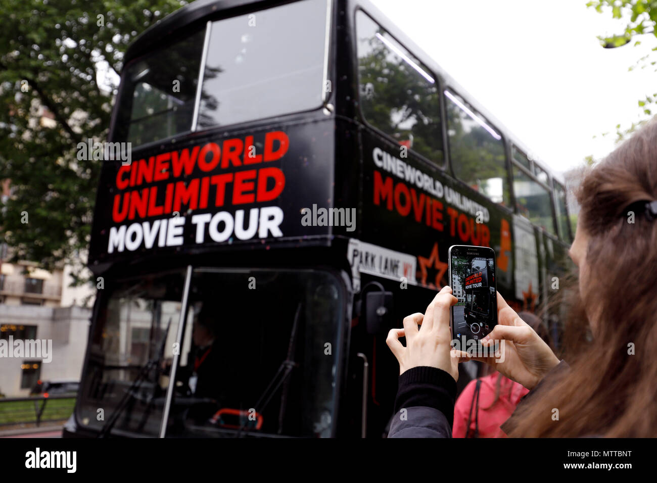 Movie fans take photos of the bus as Cineworld launches their Unlimited ...