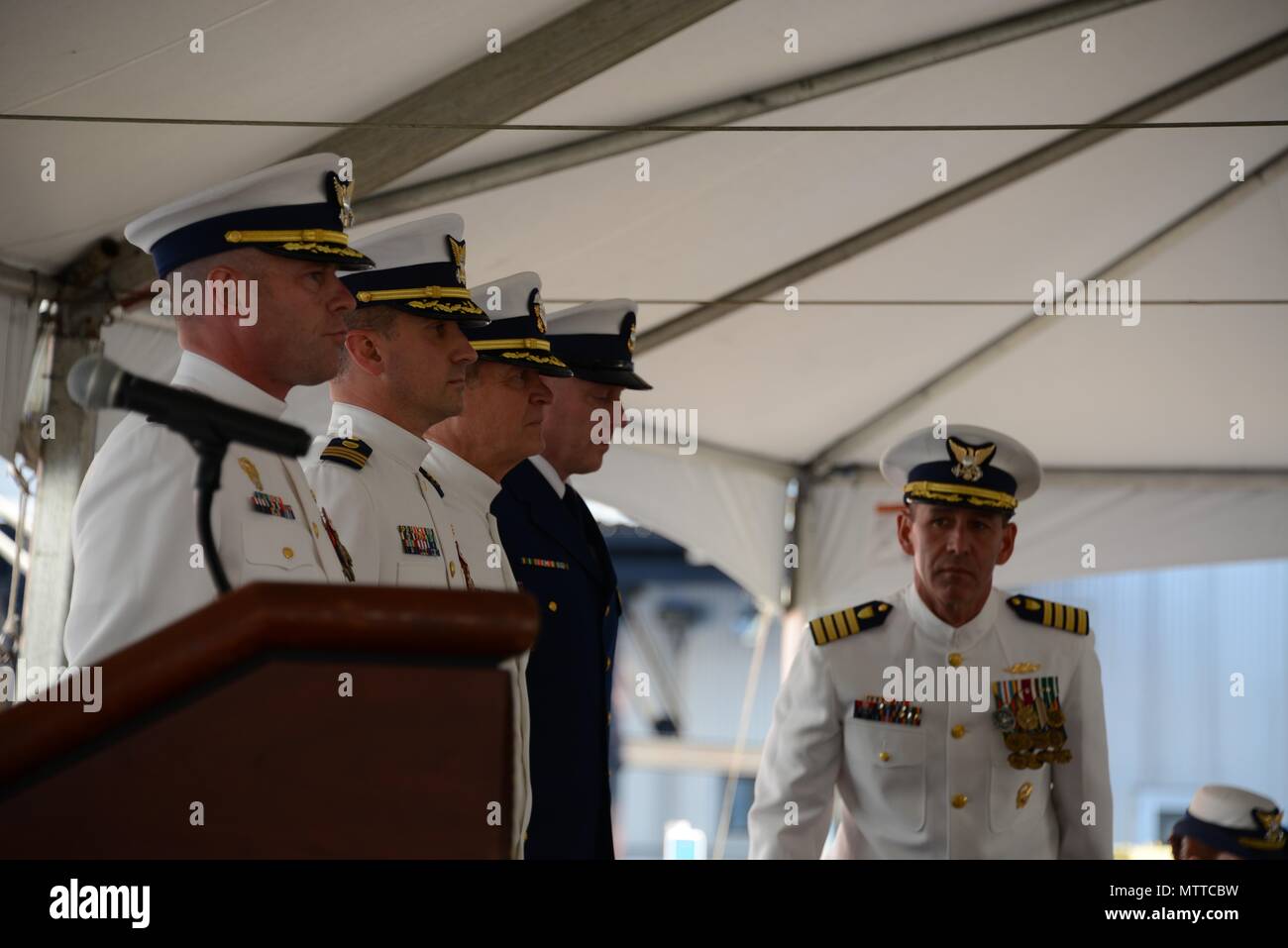 A change of command ceremony honors Cmdr. Alan B. McCabe (far left ...