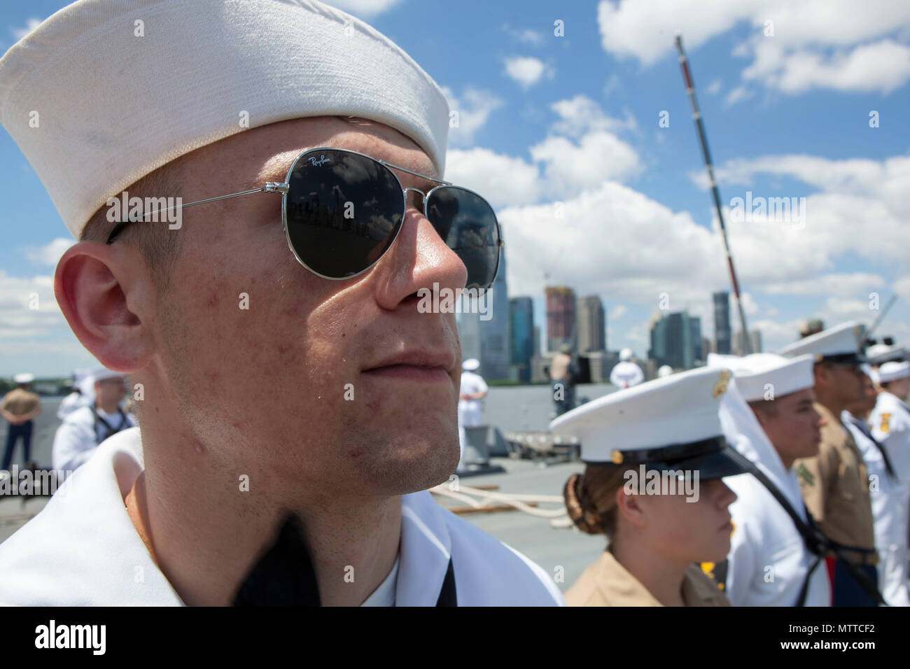 A Sea Cadet stands at parade rest aboard USS Arlington (LPD 24) during ...