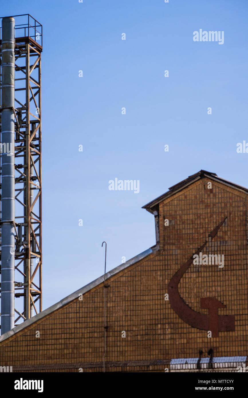 Building with Soviet symbols of sickle and hammer Stock Photo - Alamy