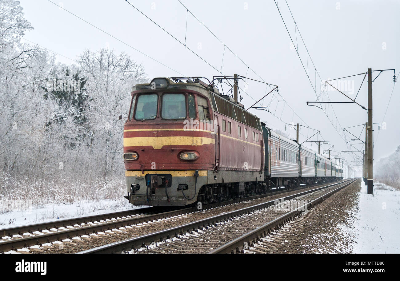 Passenger train hauled by electric locomotive Stock Photo - Alamy