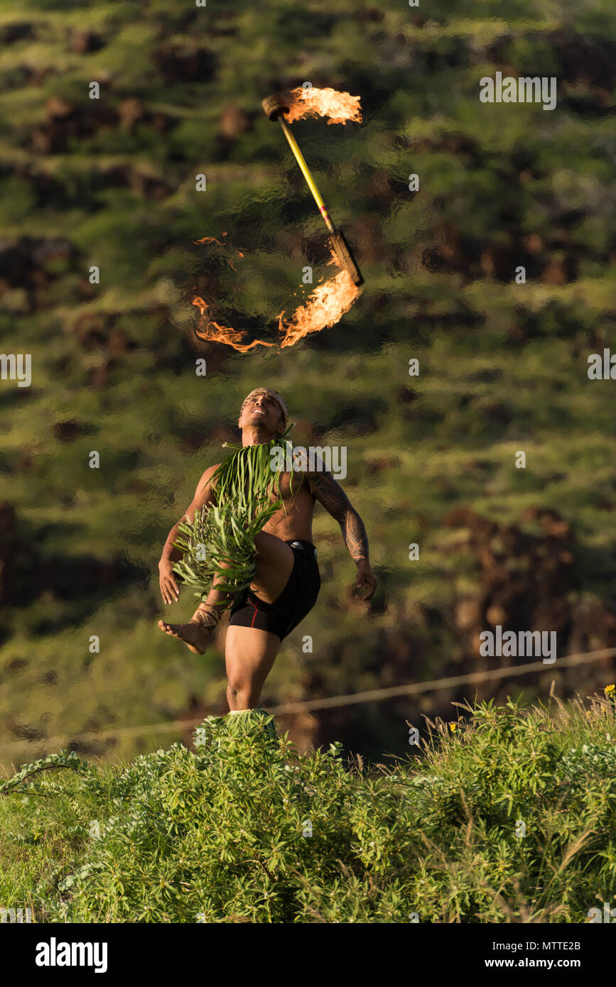Male fire dancer performing with fire levi stick Stock Photo - Alamy