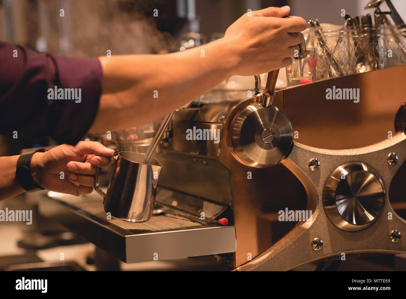 Waiter preparing coffee in coffee shop Stock Photo - Alamy