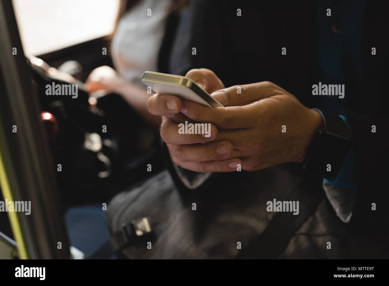 Man mobile phone bus hi-res stock photography and images - Alamy