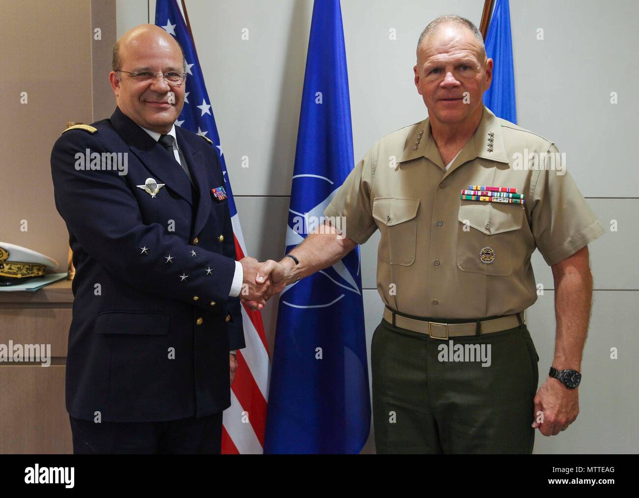 Commandant of the Marine Corps Gen. Robert B. Neller shakes hands with ...