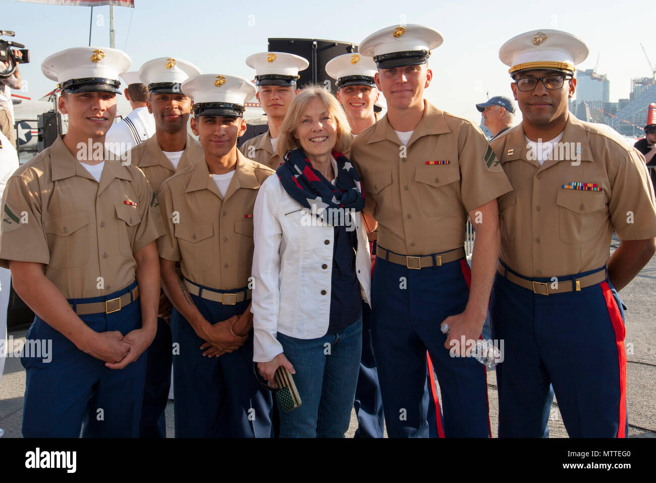 U.S. Marines pose for a photo with Susan Marenoff-Zausner, center ...
