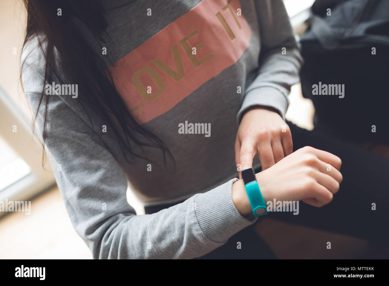 Female dancer using smartwatch in dance studio Stock Photo - Alamy