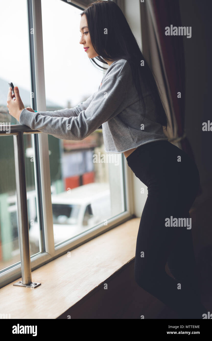 Female dancer using mobile phone in dance studio Stock Photo - Alamy