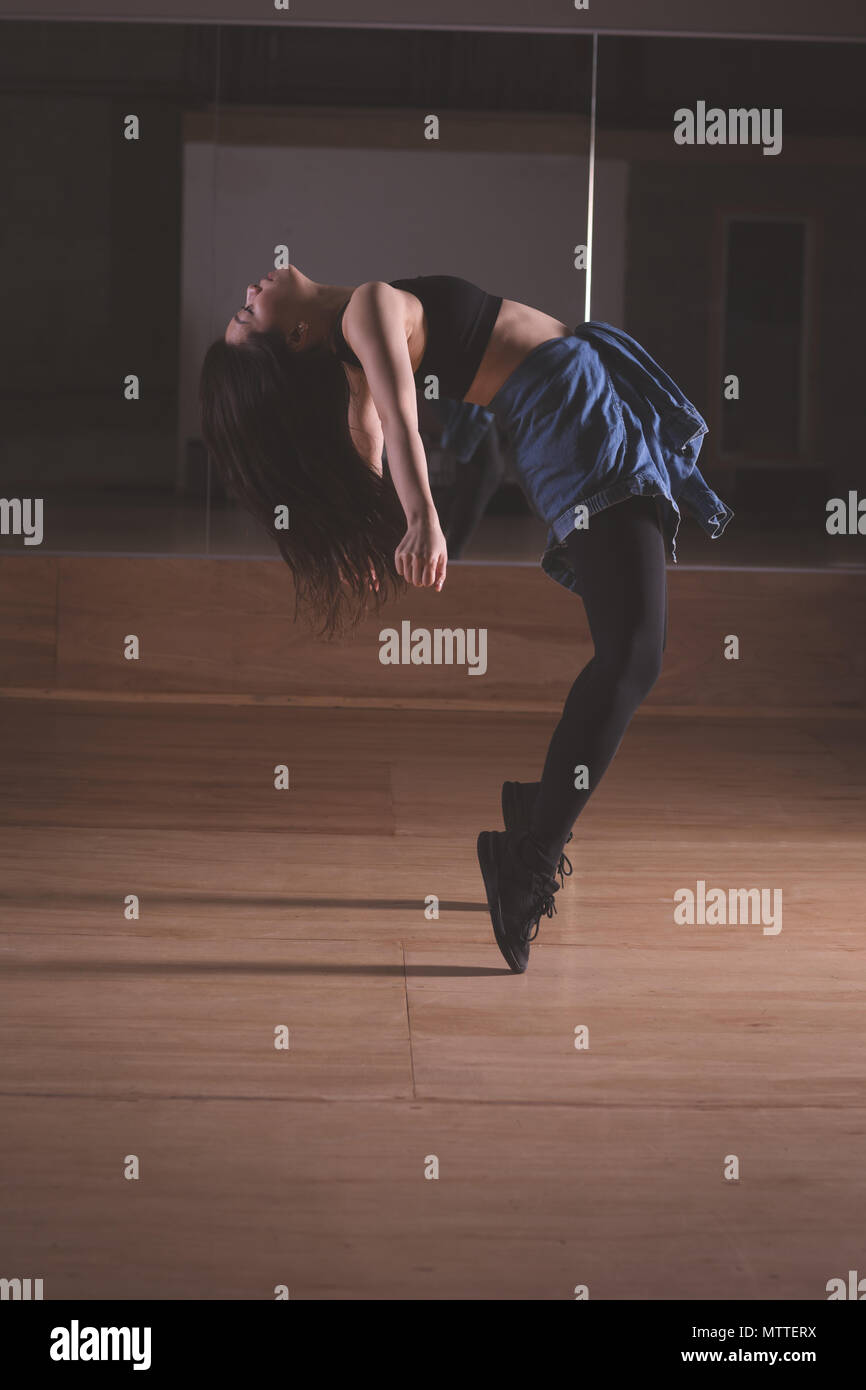 Young woman dancing in studio hi-res stock photography and images - Alamy