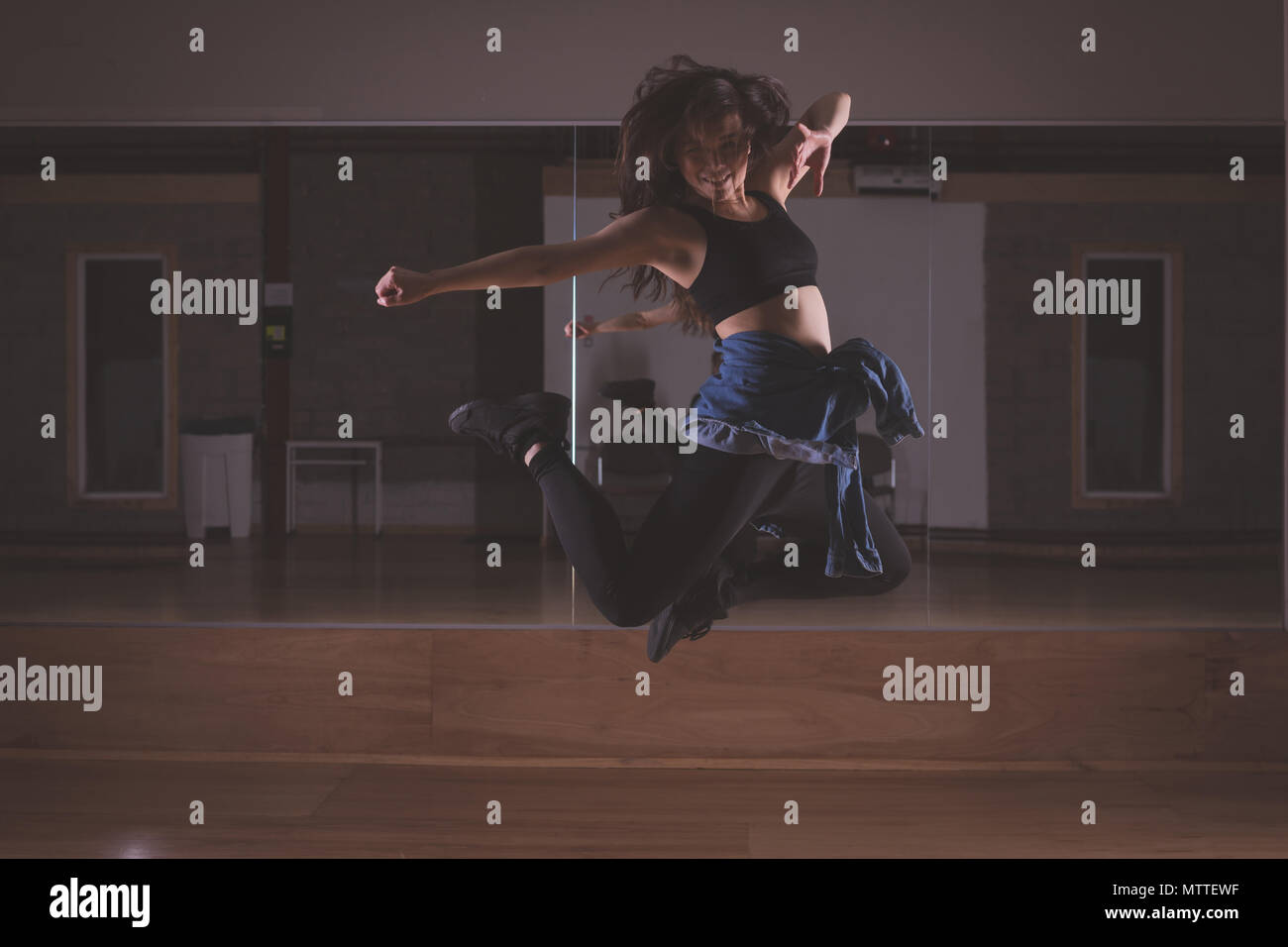 Female dancer dancing in dance studio Stock Photo - Alamy