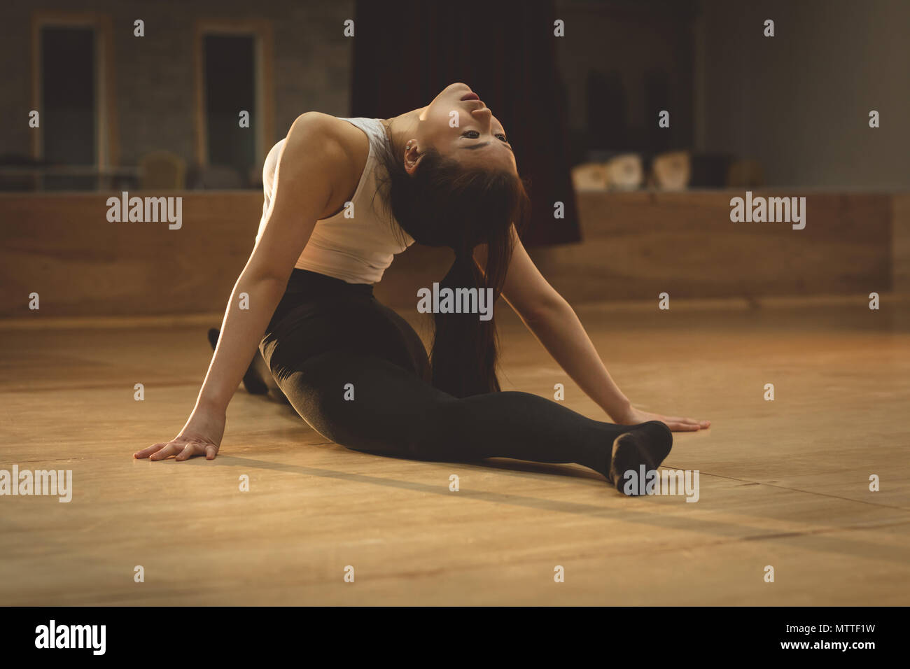 Female dancer exercising in dance studio Stock Photo - Alamy