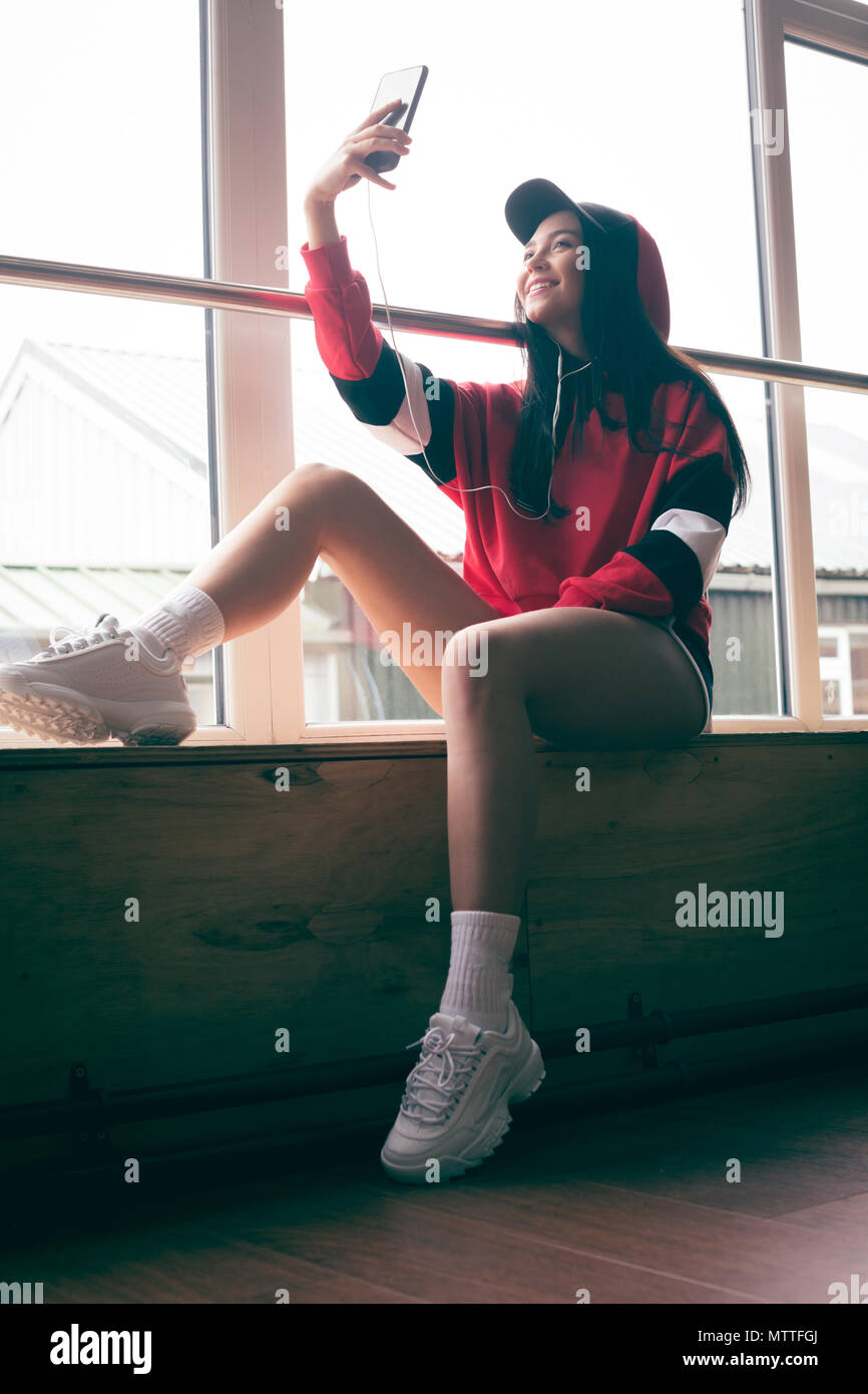 Female dancer taking selfie with mobile phone in dance studio Stock ...