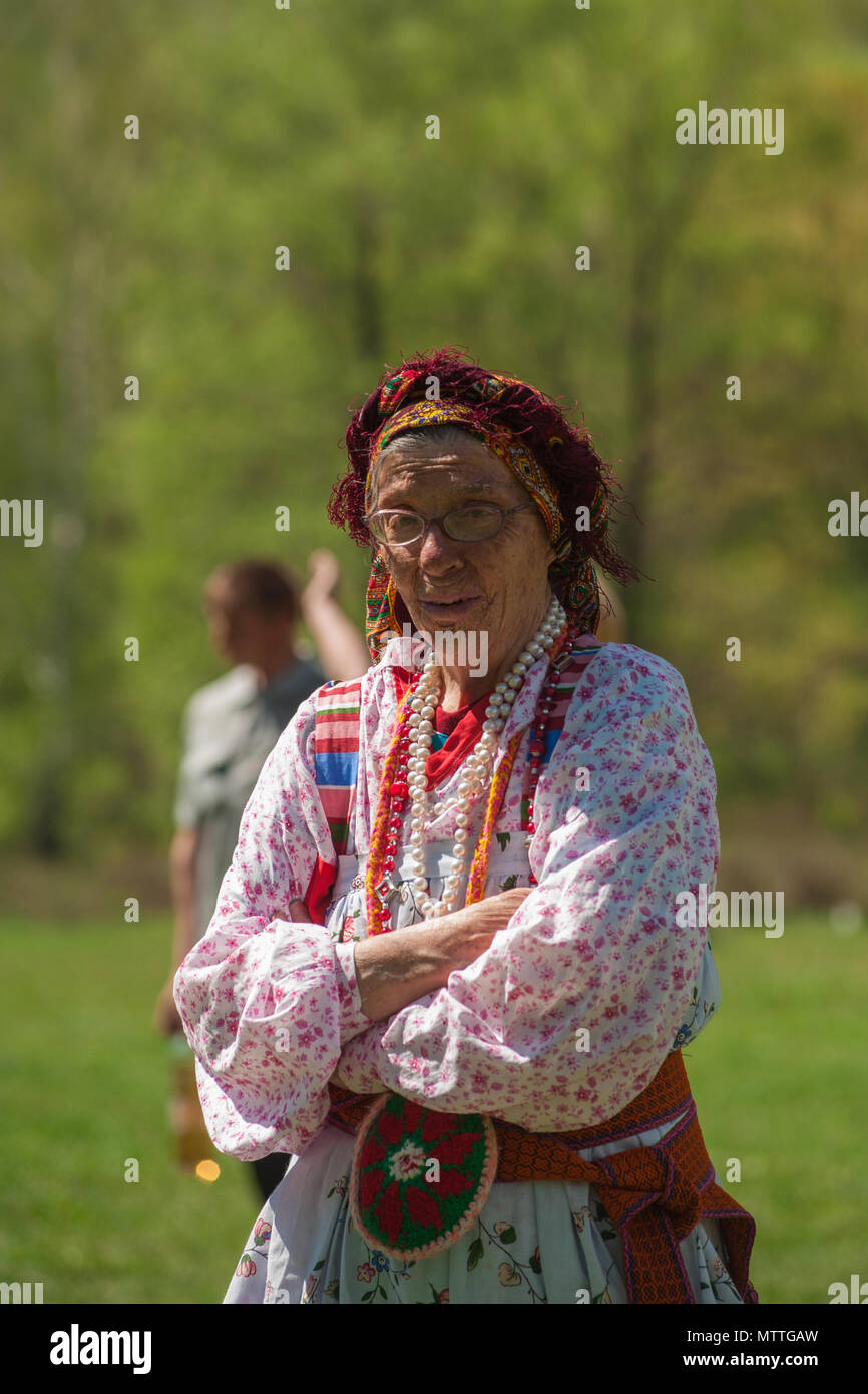 Happy old woman in traditional dress Stock Photo - Alamy