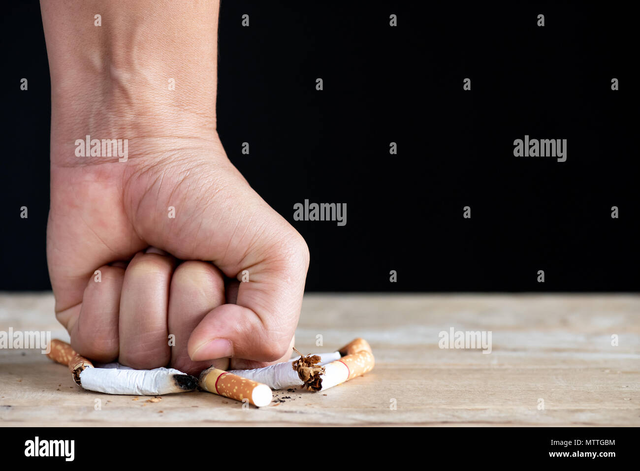 World No Tobacco Day, May 31. STOP Smoking. Close up Man hand crushing ...