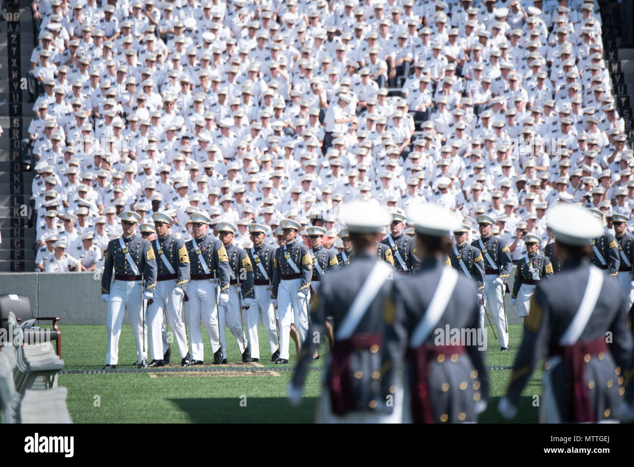 U.S. Military Academy cadets march onto the field to kick off their ...